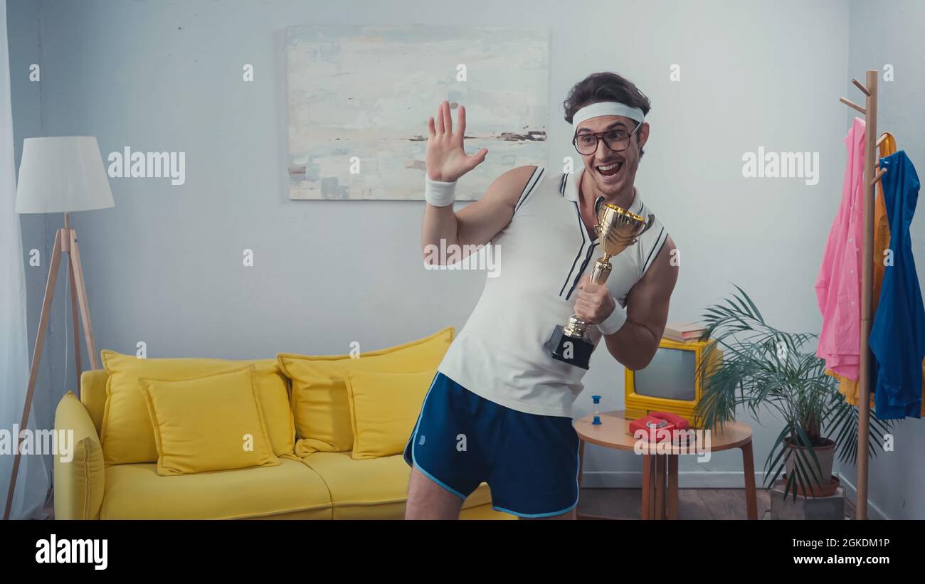 Man holding trophy room hi-res stock photography and images - Alamy