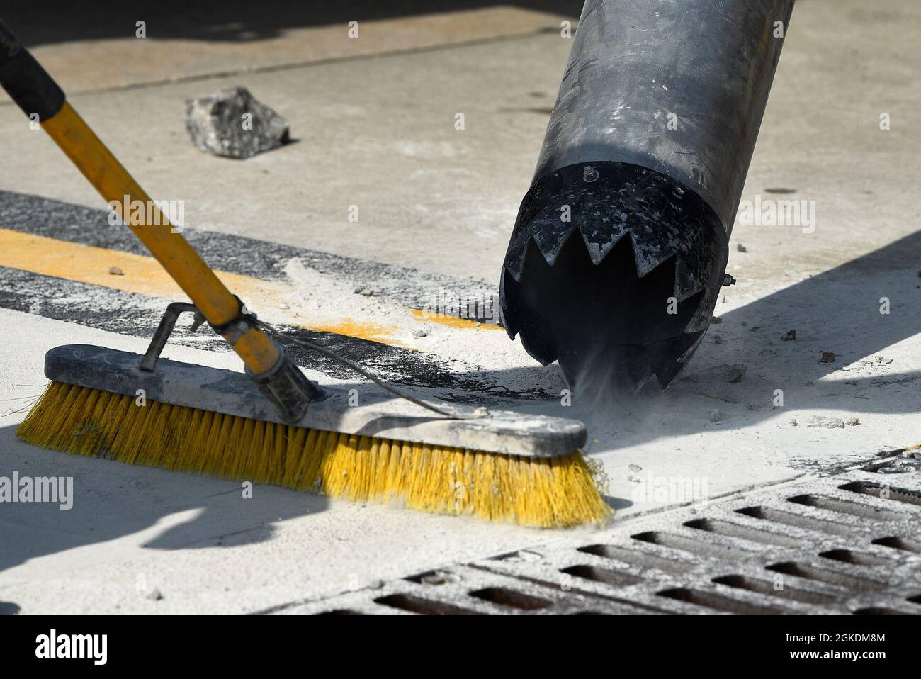 Personnel assigned to the 8th Civil Engineer Squadron vacuum debris on ...