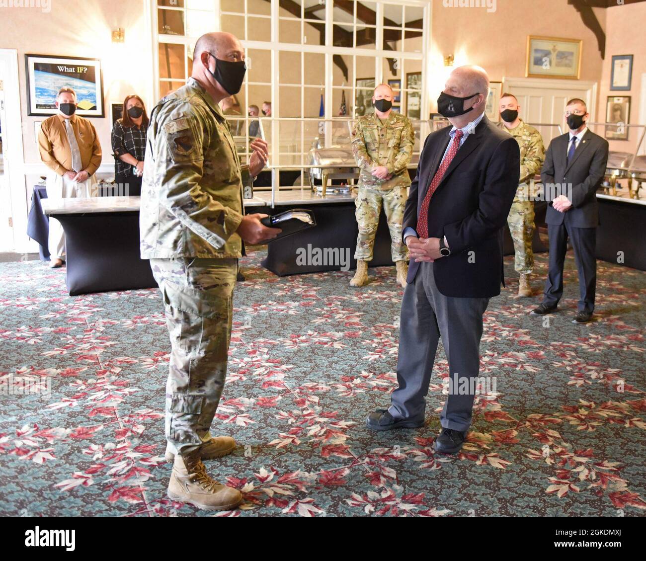 Acting Secretary of the Air Force John Roth talks with Col. Patrick ...