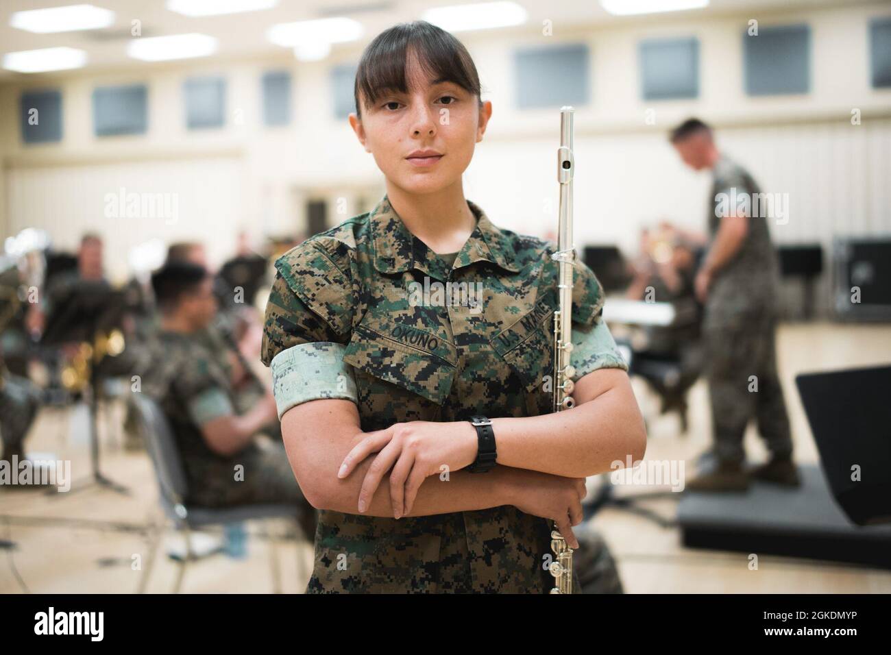 U.S. Marine Corps Lance Cpl. Caroline Okuno, a flutist with the 1st ...
