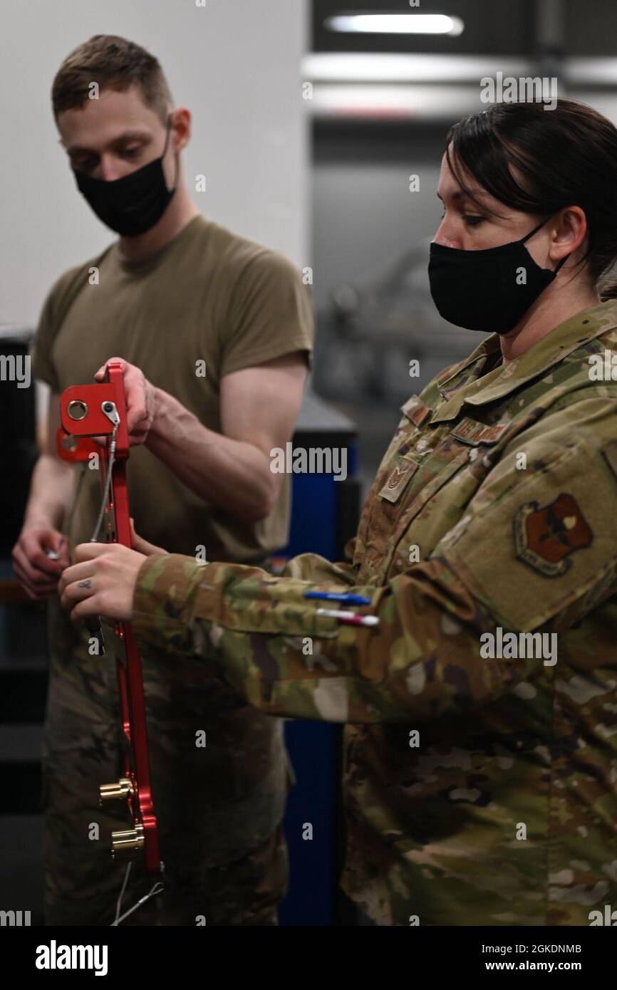 U.S. Air Force Tech. Sgt. Amanda Dennis, left, 33rd Maintenance Squadron (MXS) egress section ...