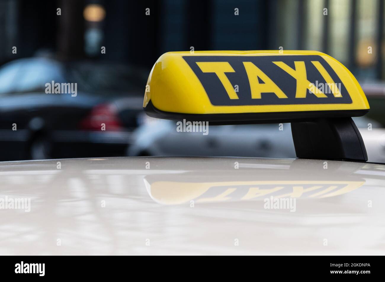 Taxi sign on a German taxi taken from the left Stock Photo - Alamy