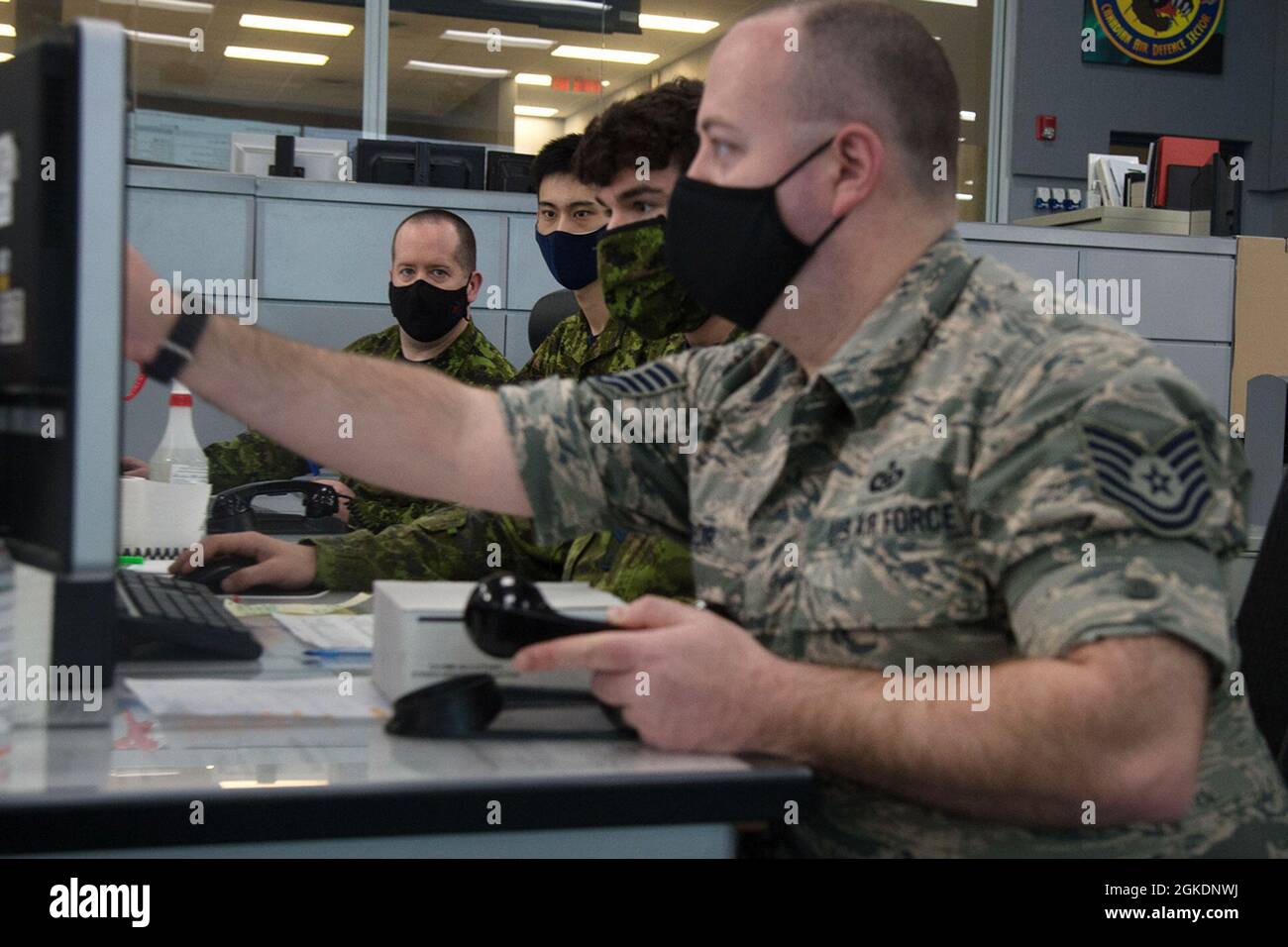 Members of 21 Aerospace Control and Warning Squadron monitor Canadian ...