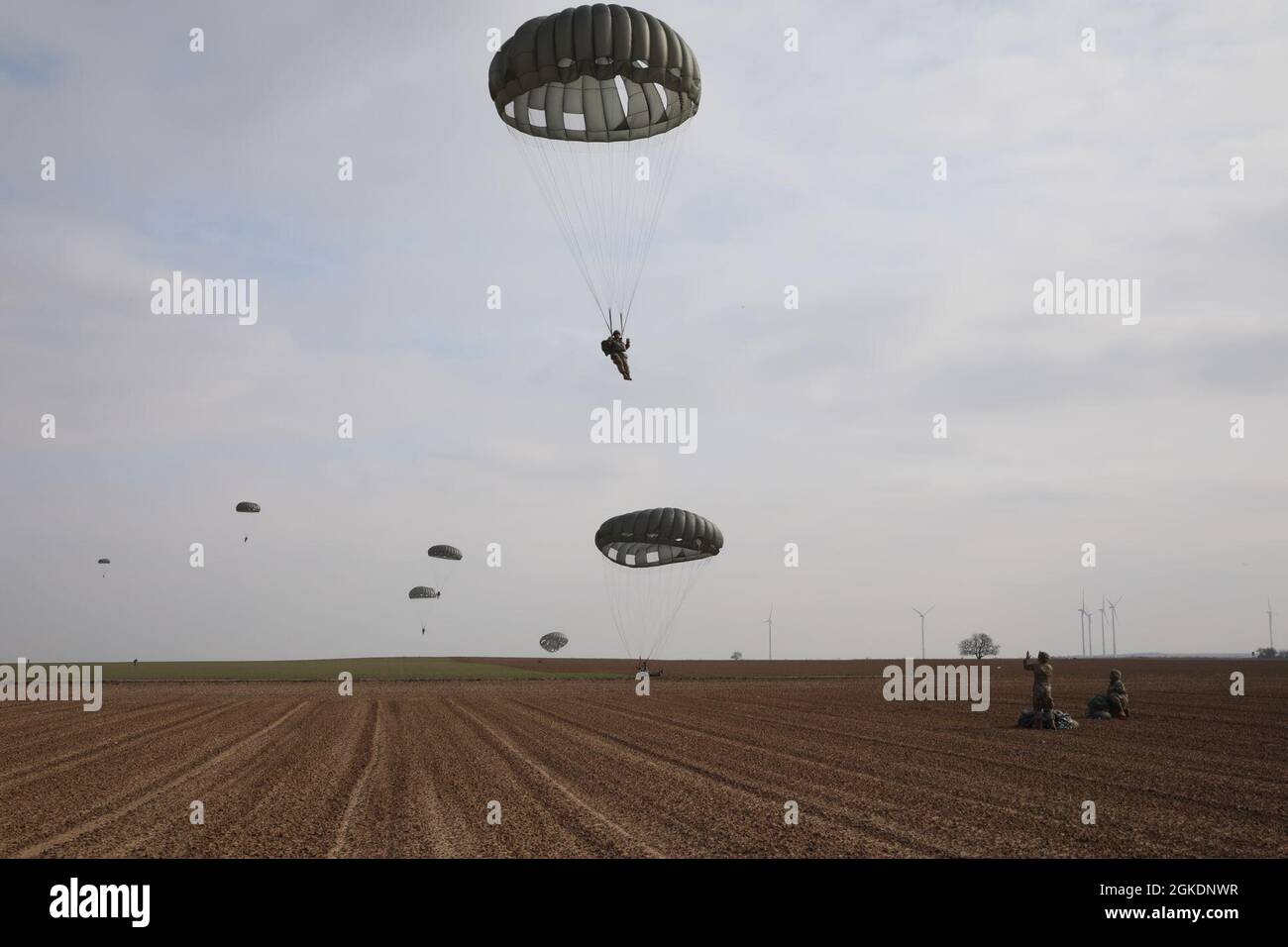 U.S. paratroopers jump off a CH-47 Chinook helicopter during an ...