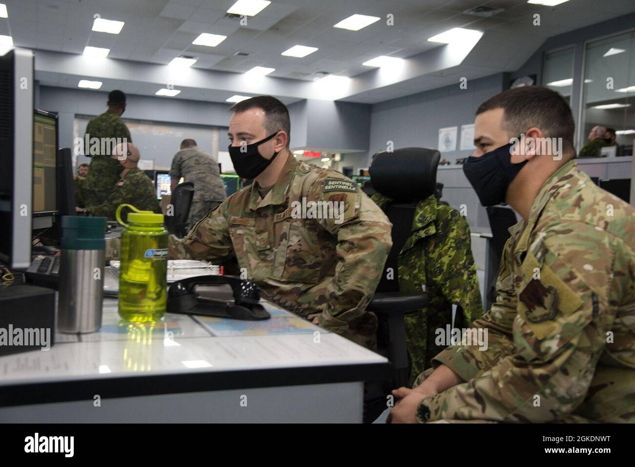 Members of 21 Aerospace Control and Warning Squadron monitor Canadian ...