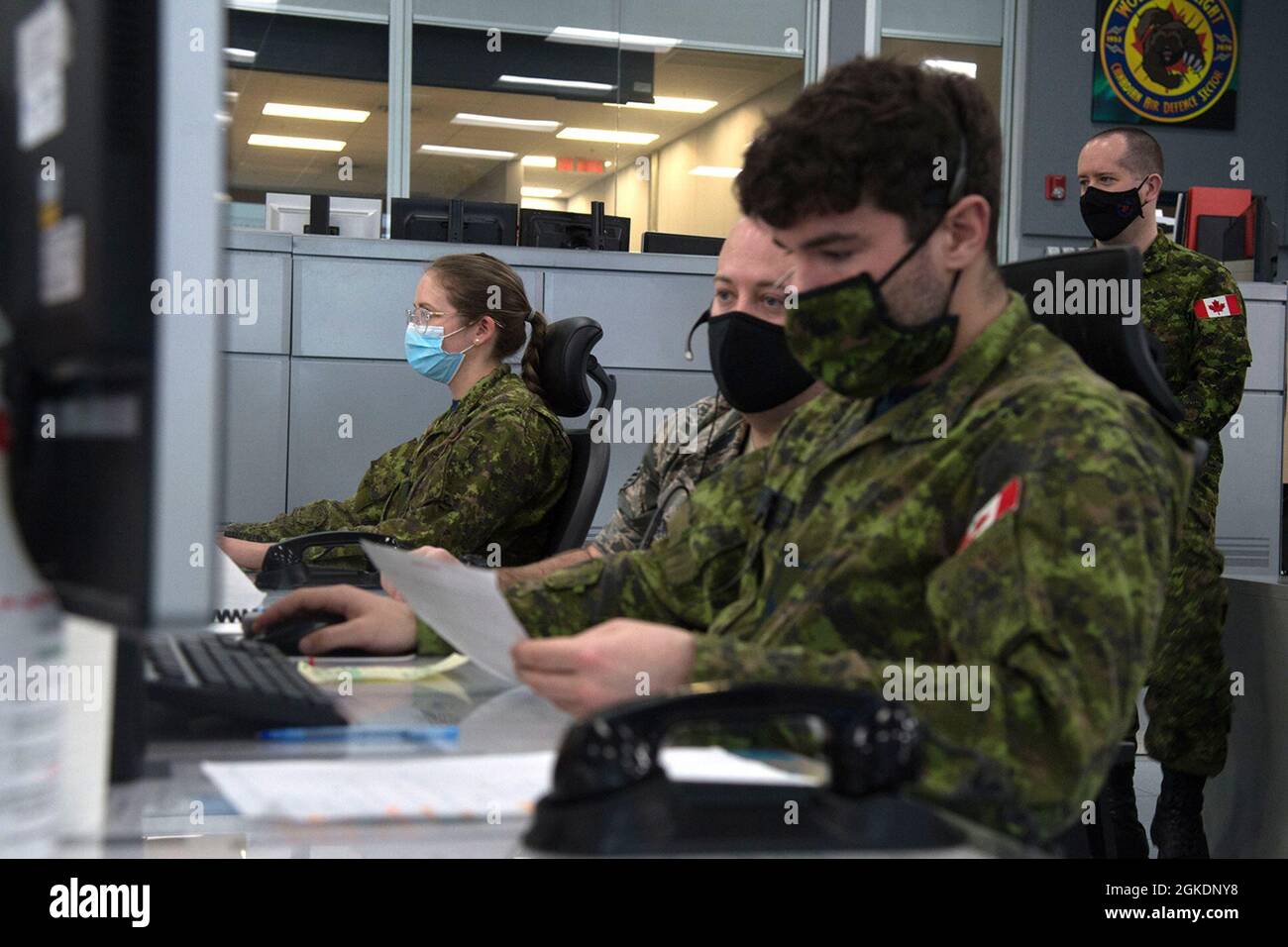 Members of 21 Aerospace Control and Warning Squadron monitor Canadian ...