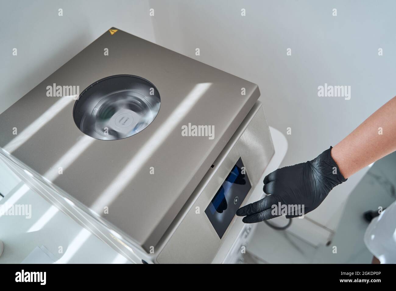 Doctor making a platelet-rich plasma serum using a laboratory equipment ...