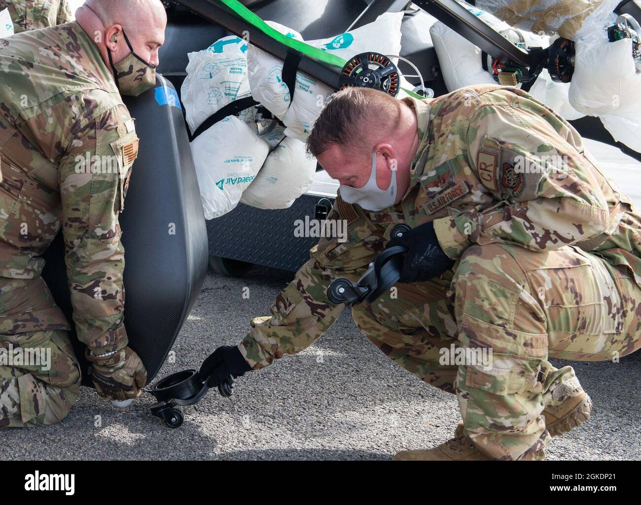 U.S. Airmen from the 79th Rescue Squadron and the 571st Mobility ...