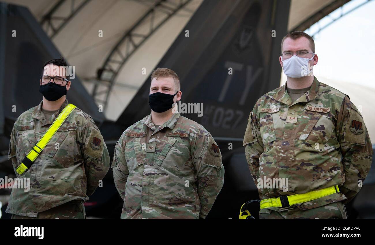 A 325th Aircraft Maintenance Squadron loadcrew waits for the command to ...