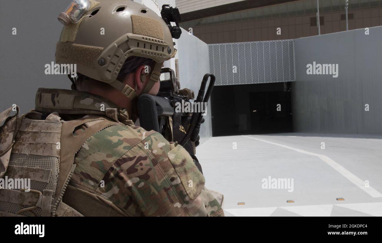 A U.S. Special Operations Forces member secures a corner in a simulated ...
