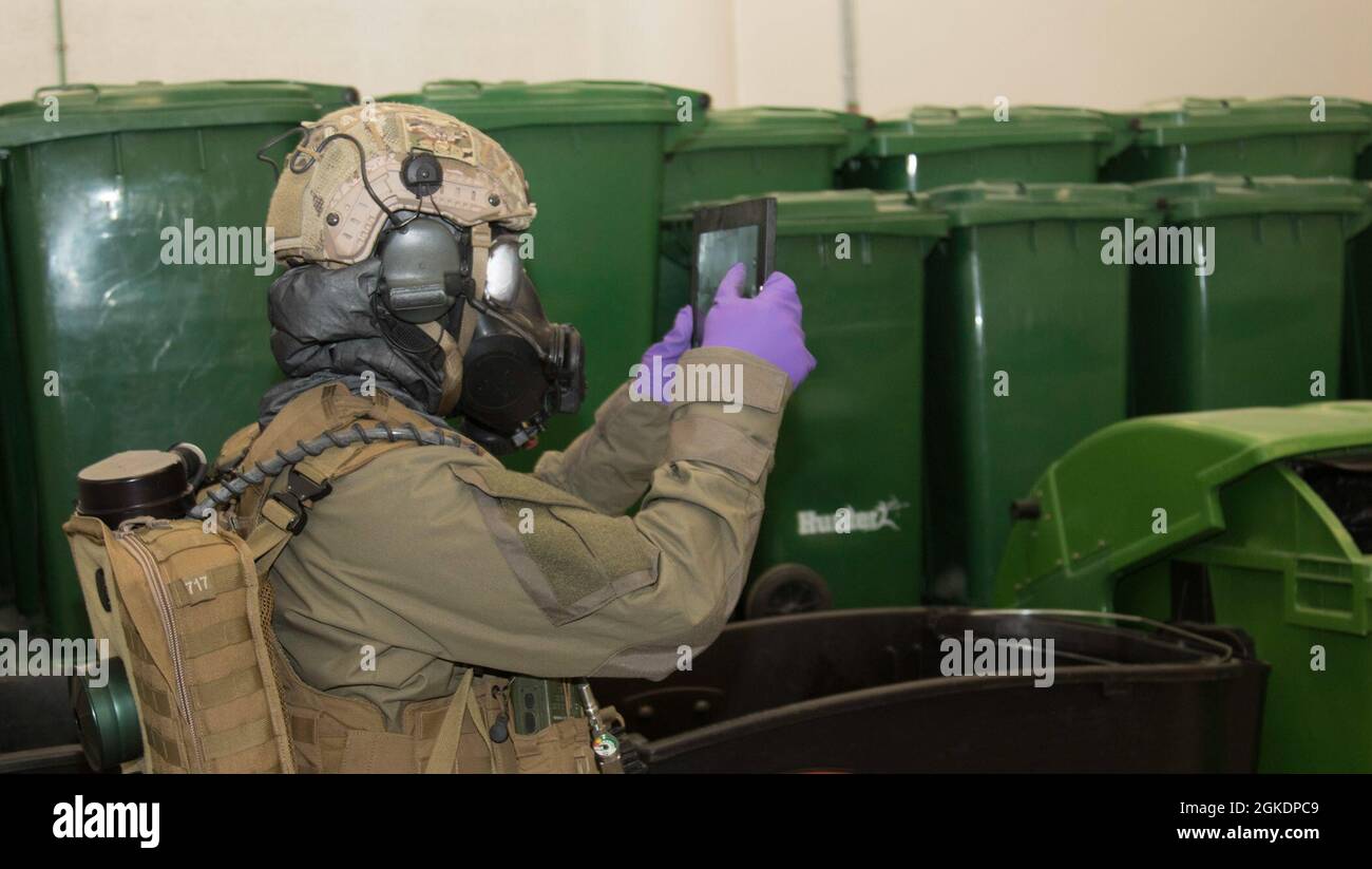 A U.S. Special Operations Forces member takes pictures of a crisis ...