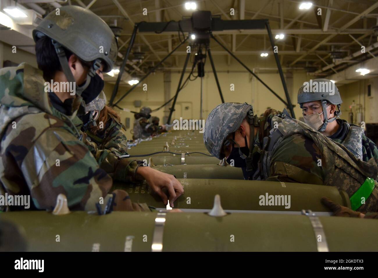 Eighth Maintenance Squadron Airmen tighten the umbilical cover straps ...