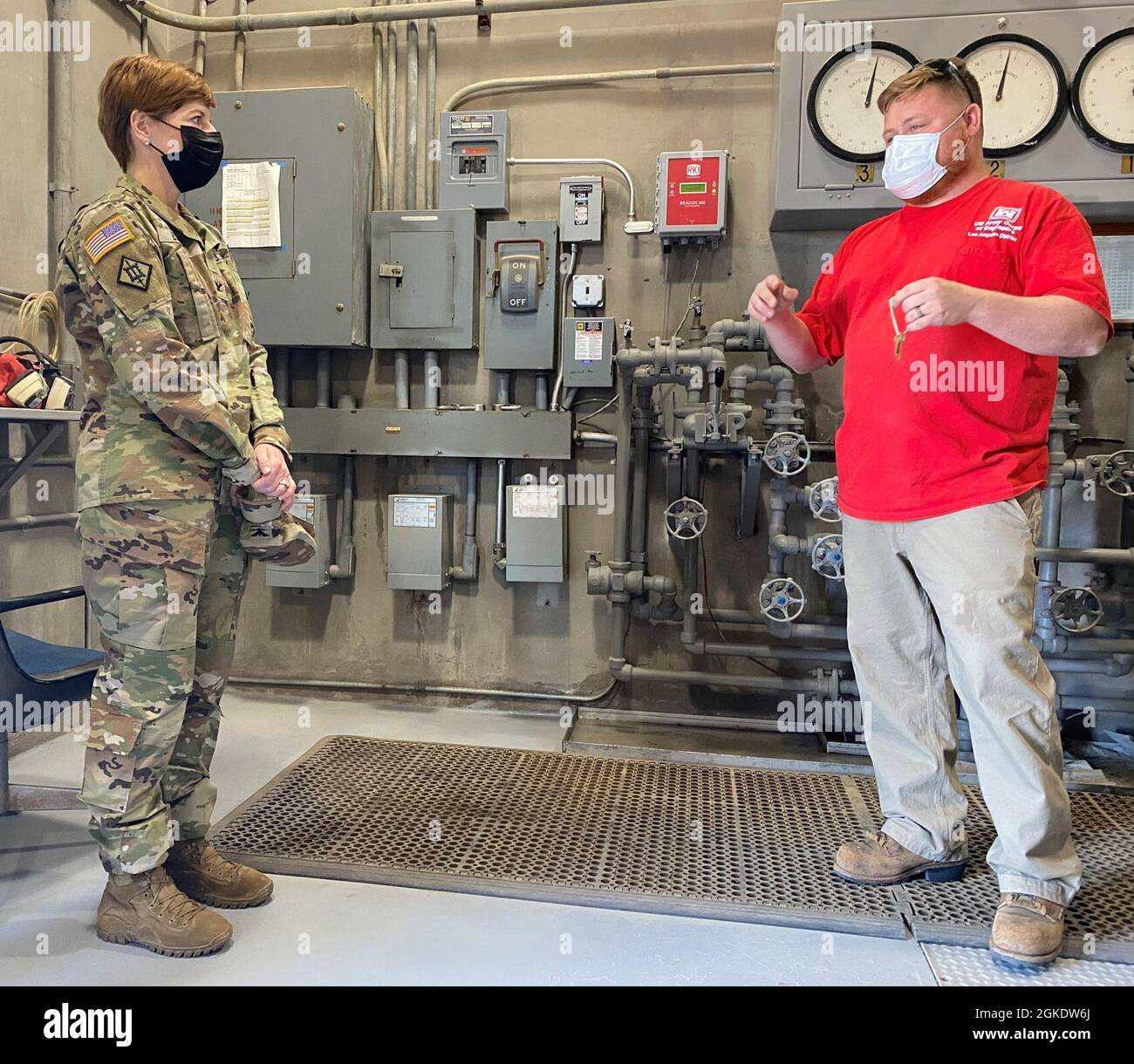 William Kramer, dam operator, briefs Col. Julie Balten, U.S. Army Corps ...