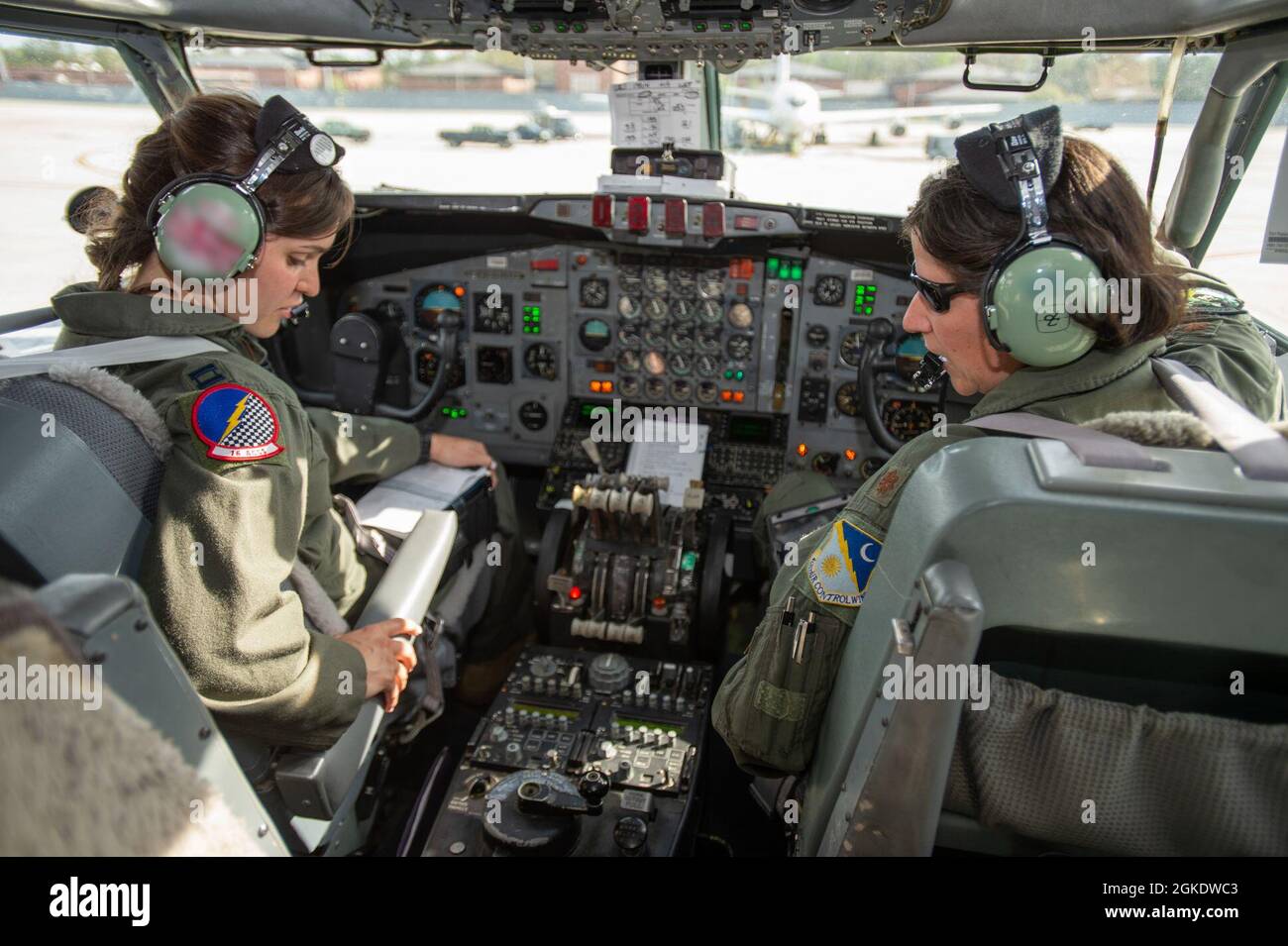 U.S. Air Force Maj. Megan Cooper, right, an instructor pilot with the ...