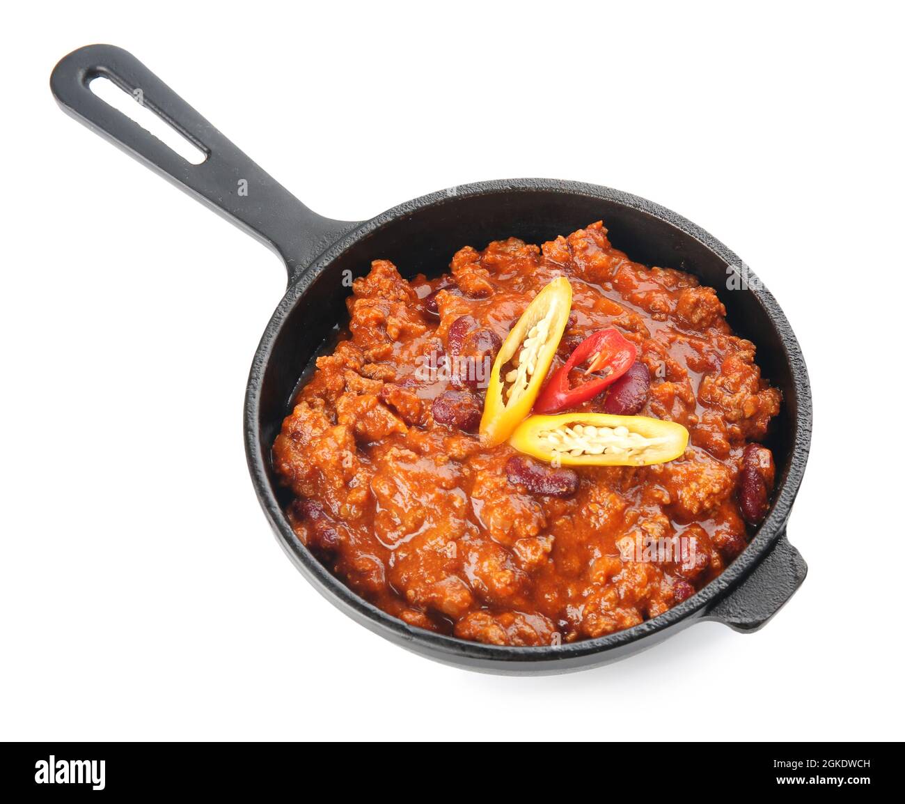 Chili con carne in frying pan on white background Stock Photo - Alamy