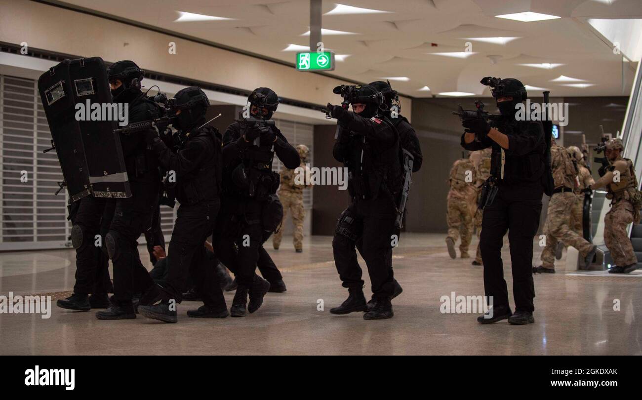 U.S. and Qatari Special Operations Forces respond to a simulated ...