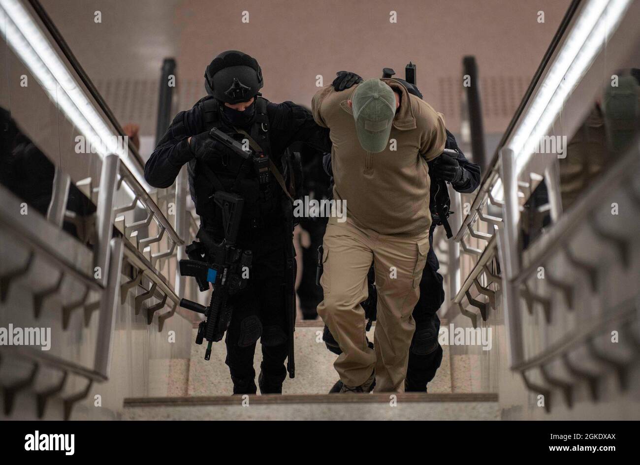 Qatari Special Forces escort a restrained gunman role-player, March 24 ...