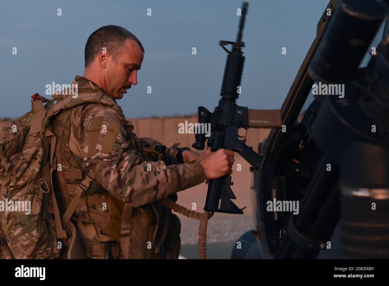 A U.S. Air Force service member assigned to the 303rd Expeditionary ...