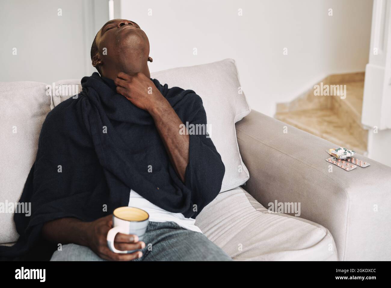man of african appearance disease cold model warm blanket runny nose ...