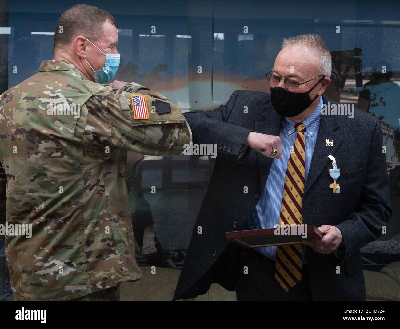 Maj. Gen. Greg Knight, adjutant general, Vermont National Guard, bumps ...