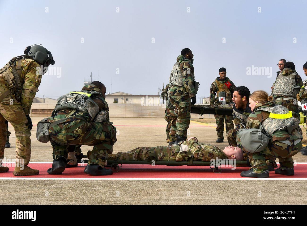 Eighth Medical Group Airmen perform a litter carry during a routine ...