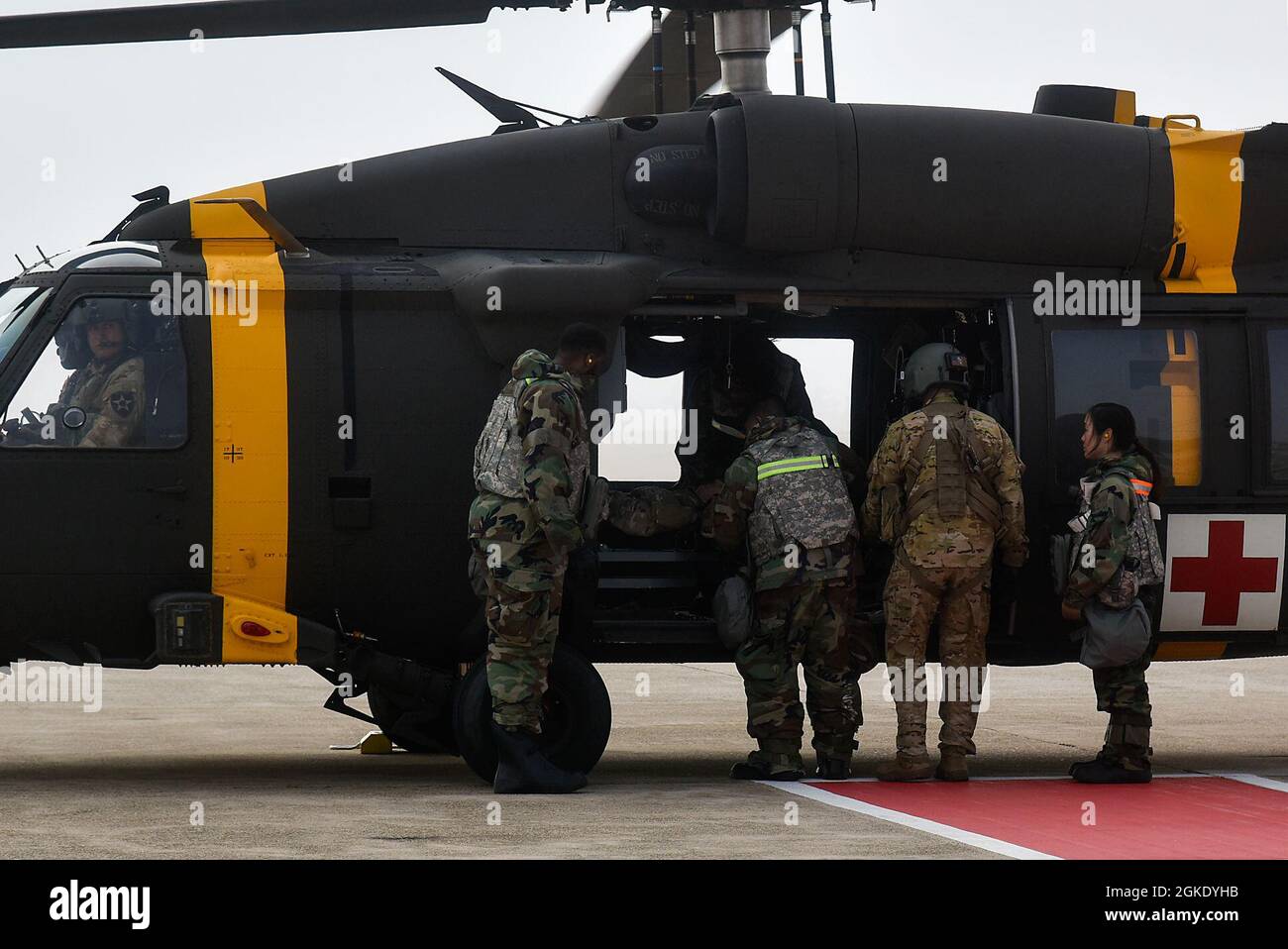 Eighth Medical Group Airmen transport a simulated patient on an HH-60M ...