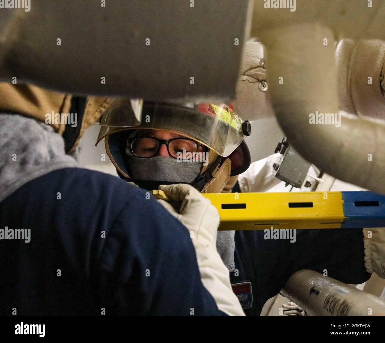 Damage Controlman 2nd Class Johnnie Vitello, from Houston, assembles I ...