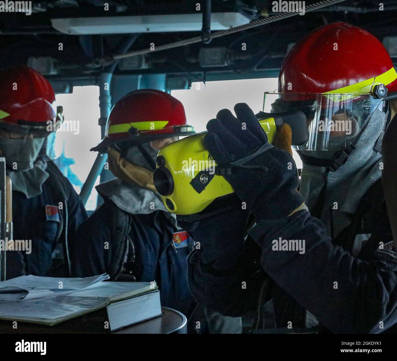 Machinist’s Mate 3rd Class Hunter Magaro, from Middletown, Pa., looks ...