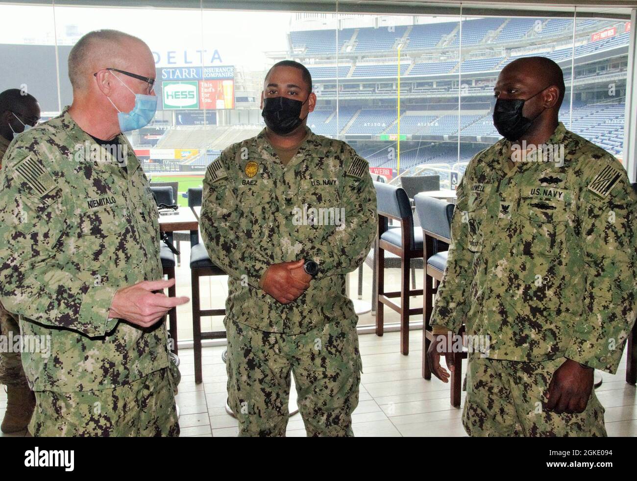 New York Naval Militia Master Chief Glenn Niemitalo, left, speaks with ...