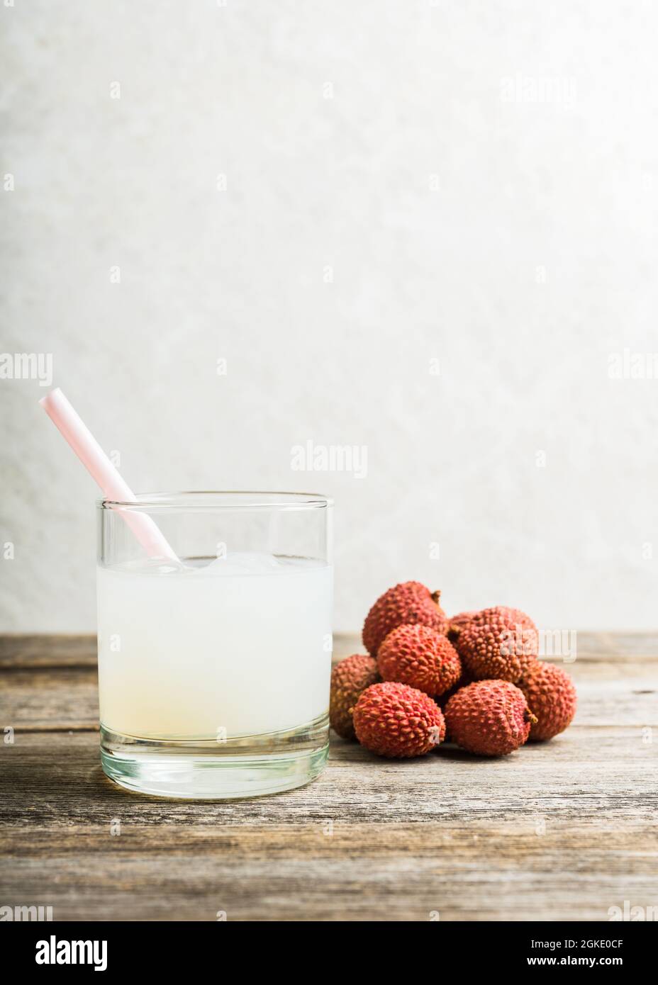 Old fashioned lychee cocktail on the rustic background. Selective focus ...