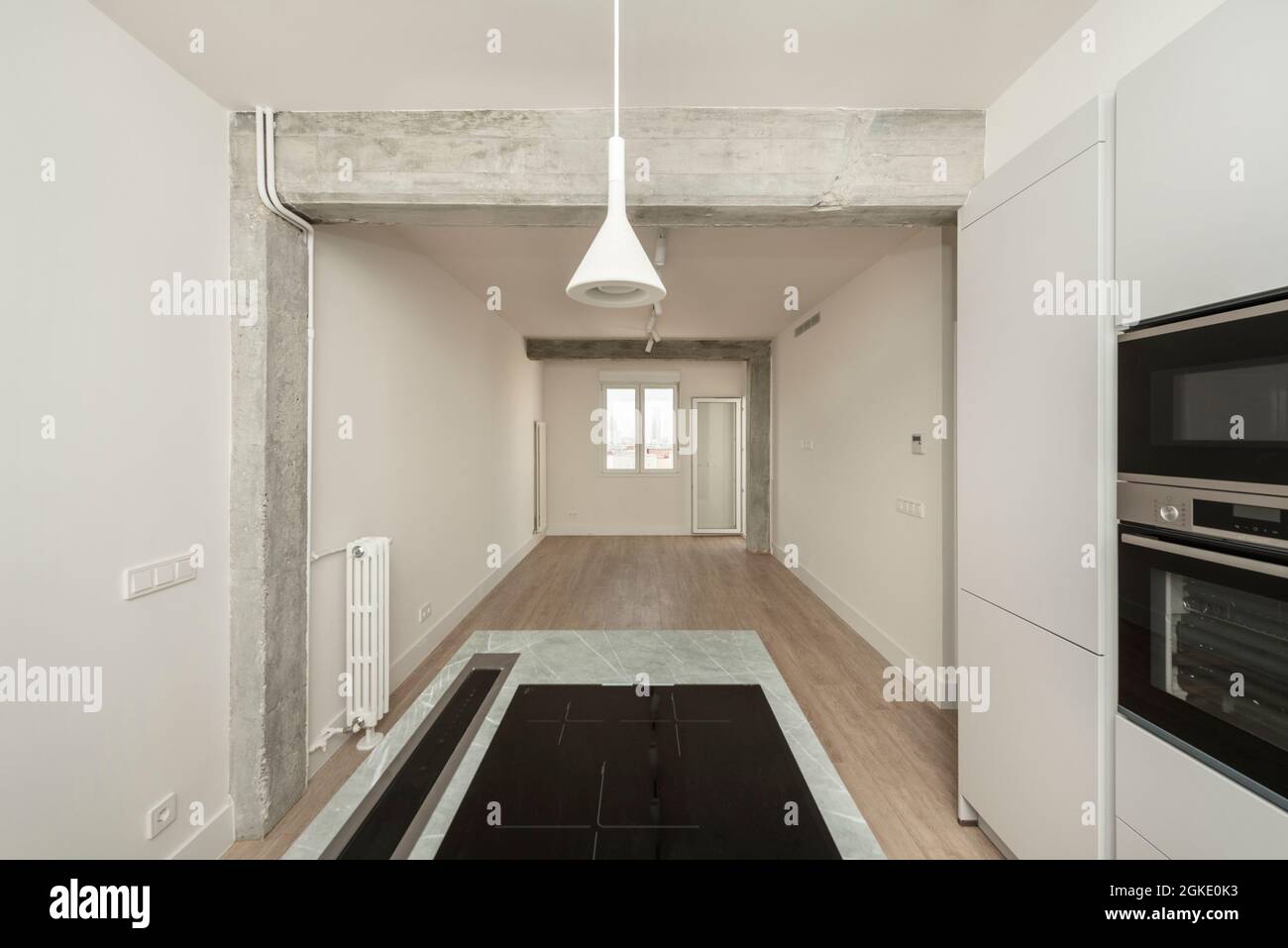 kitchen with island appliances with ceramic hob in an apartment with ...