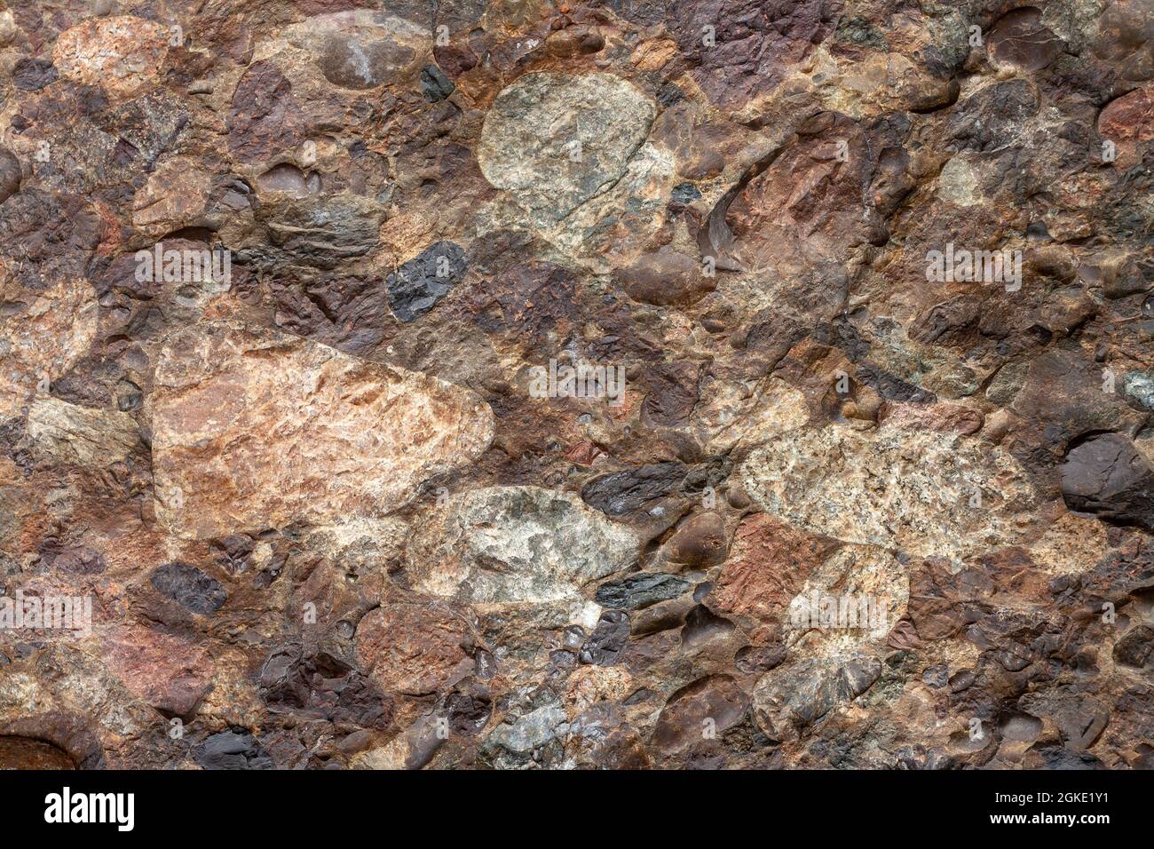 Geological section of rocky slab consisting of different stones ...