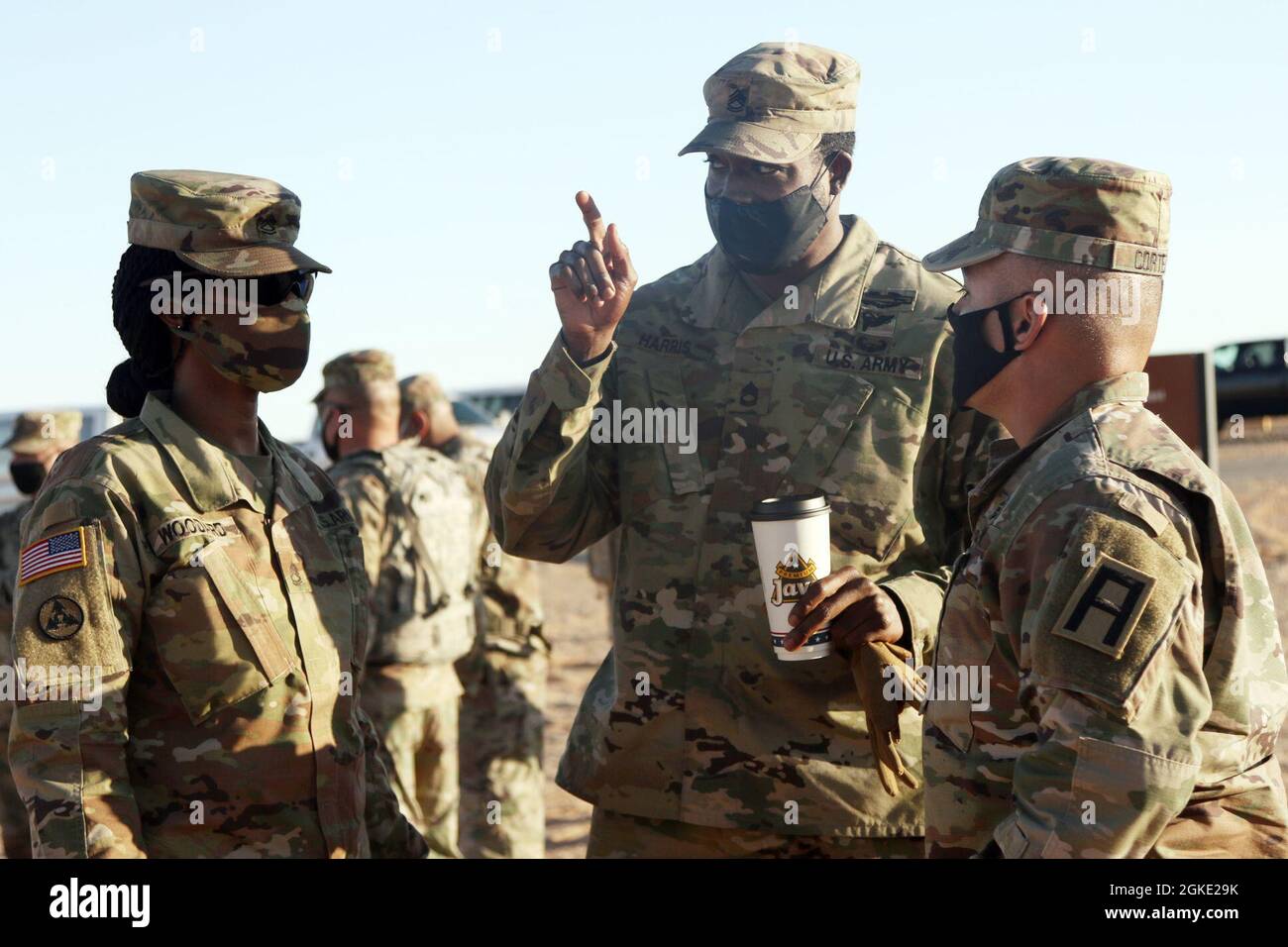 Sgt. 1st Class Rodney Harris (center), an operations planner, assigned ...