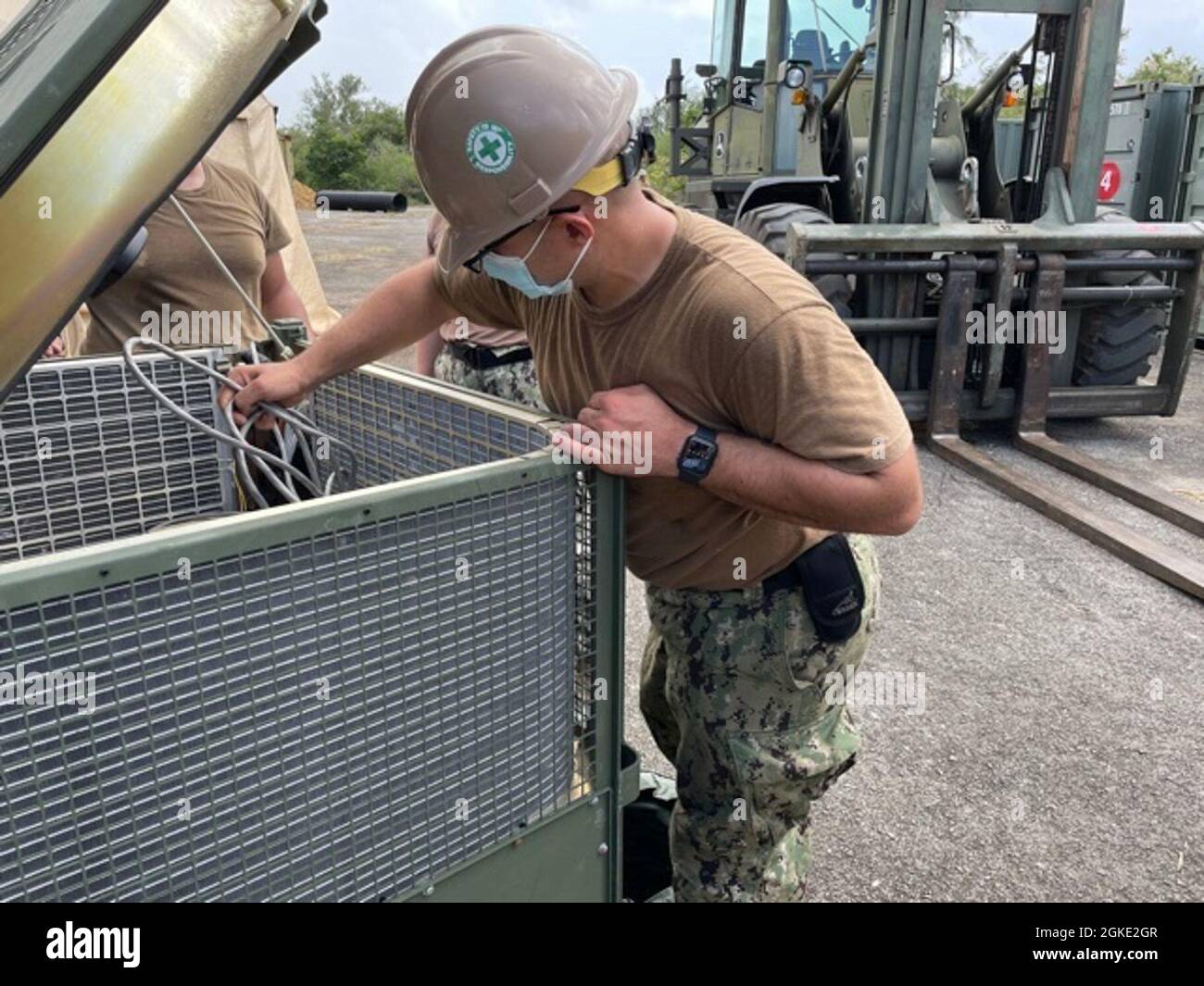 200325-N-SK929-1006 SANTA RITA, Guam (Mar. 25, 2021) A Seabee assigned ...