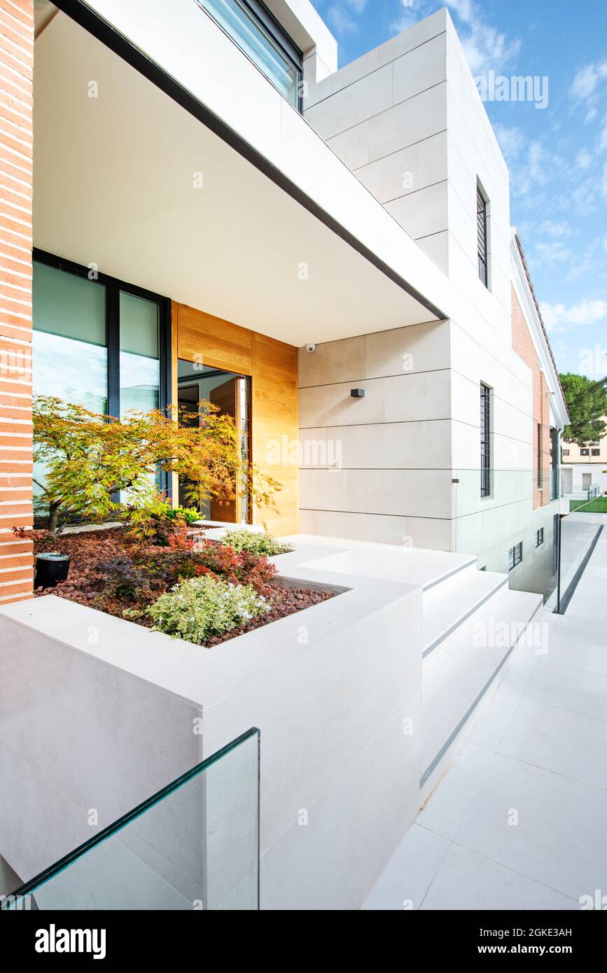 magnificent white marble entryway of detached house with zen garden and ...