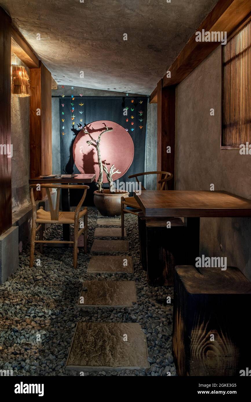 Tables in a cubicle of a Japanese restaurant with engraved floor and ...