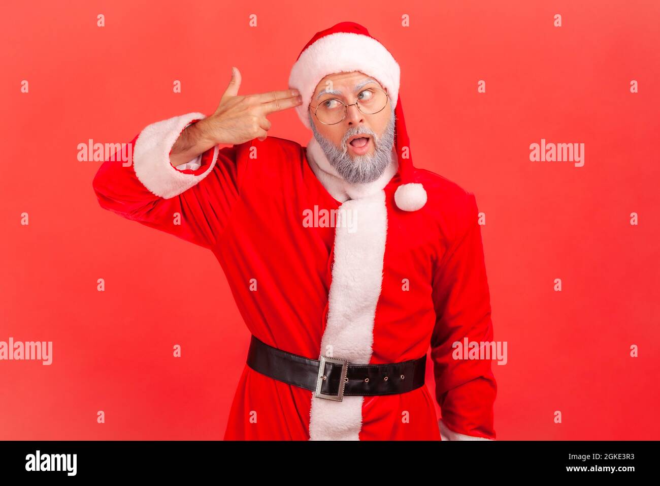 Kill me please! Elderly man with gray beard wearing santa claus costume ...