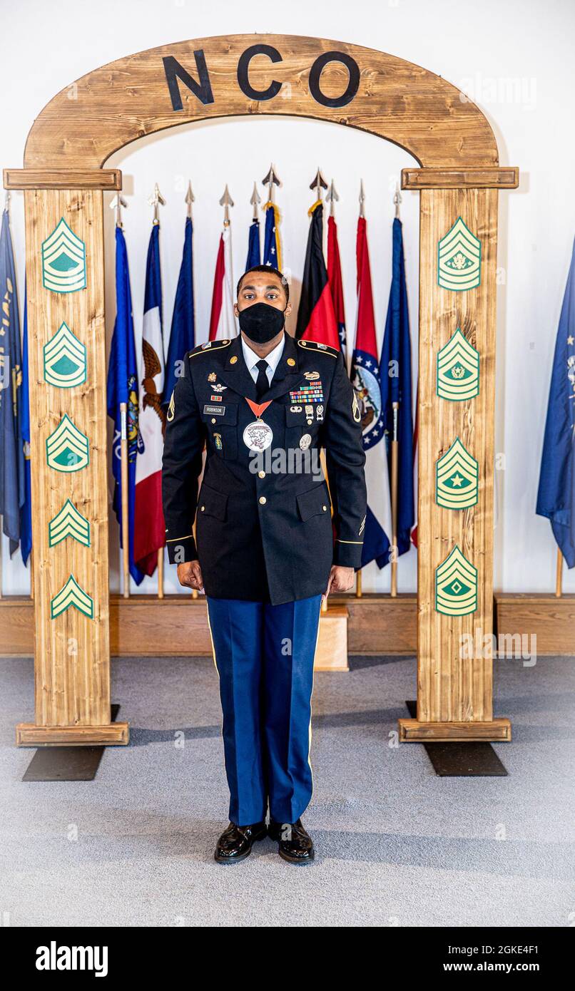 U.S. Army Staff Sgt. Damario Robinson stands at attention after being ...
