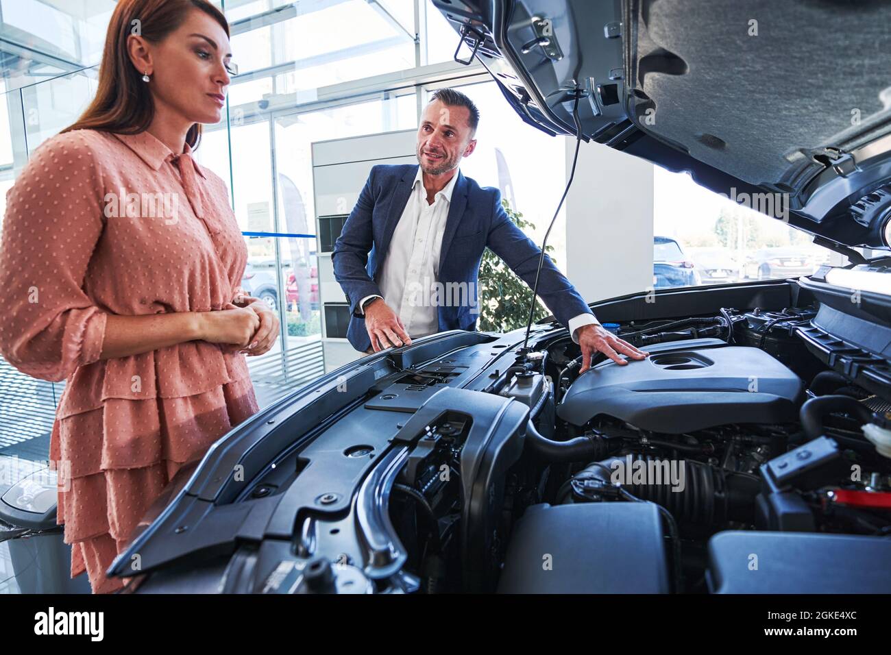Female driver being concentrated while looking at the engine Stock ...