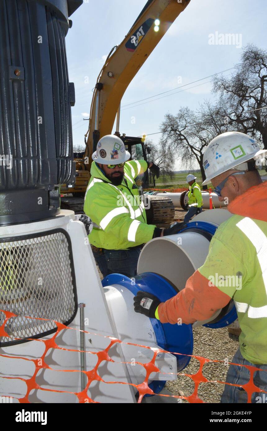 Components for the pump at the lift station are being installed as part ...