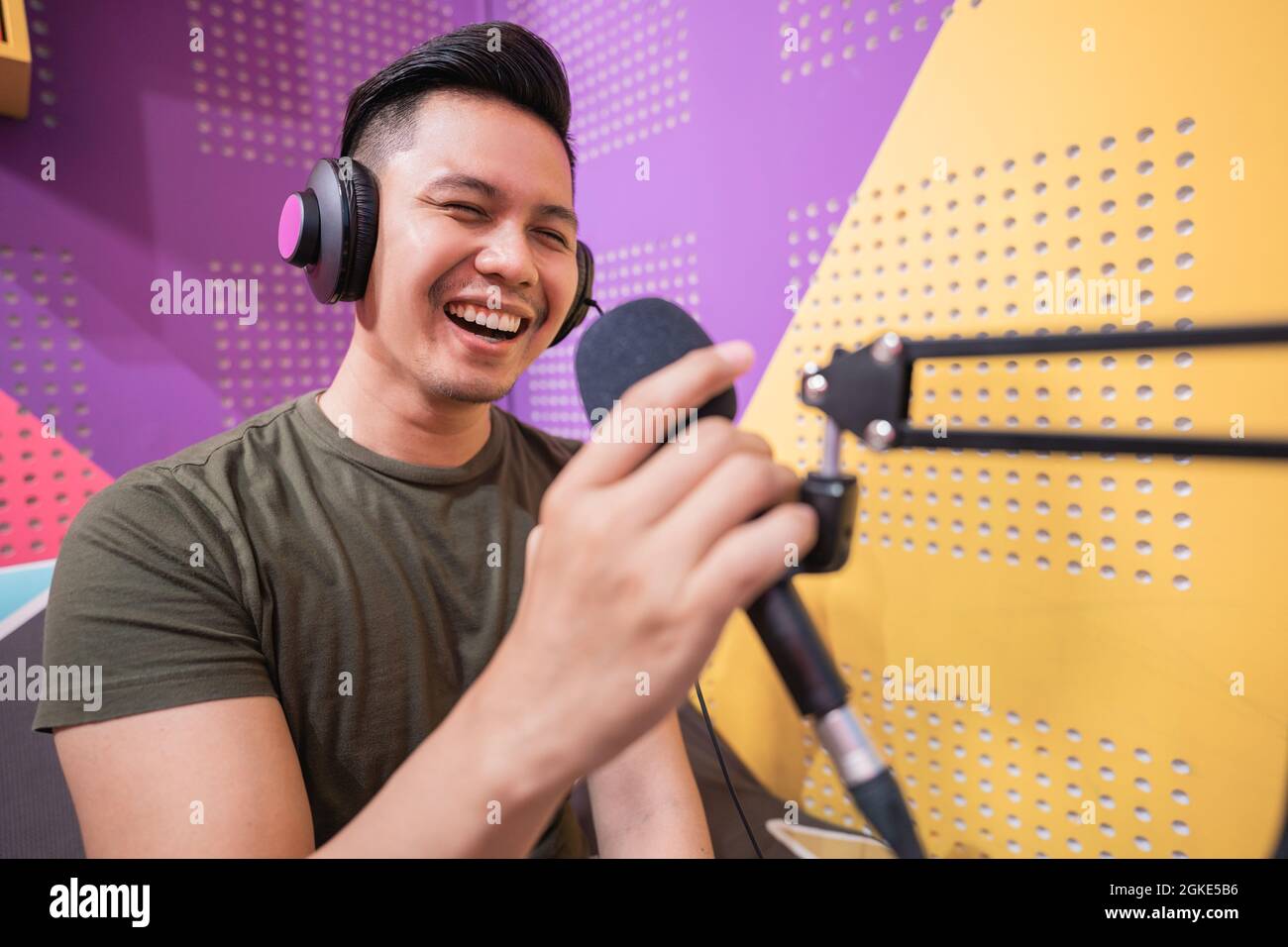 happy asian man is recording a podcast in his studio Stock Photo - Alamy