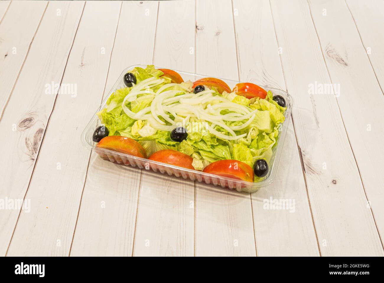 Simple mixed salad with lettuce, tomato, onion and black olives ...