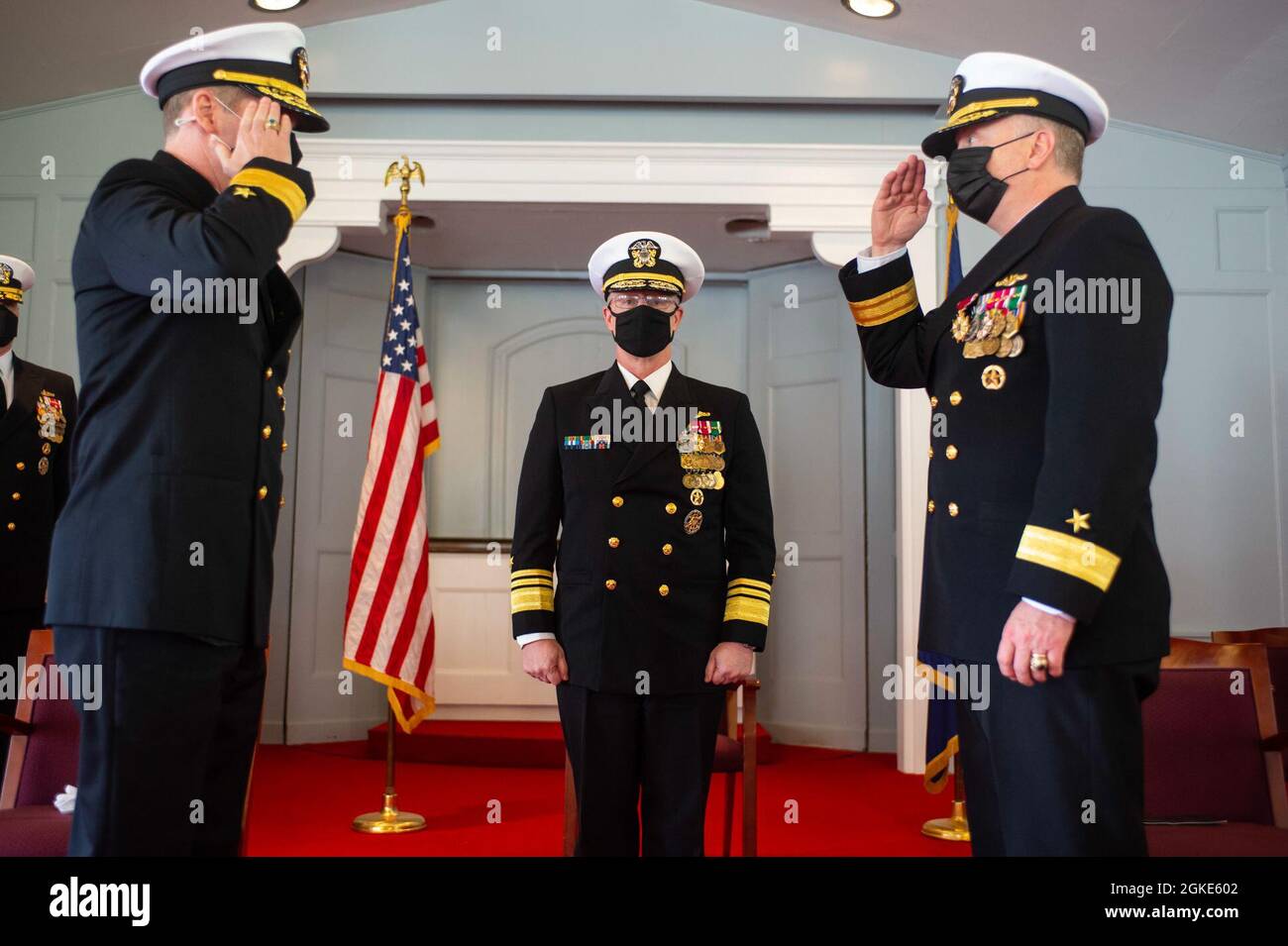 Rear Adm. Brian L. Davies, left, relieves Rear Adm. James P. Waters ...