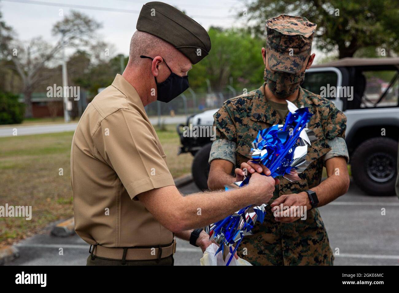 U.S. Marine Corps Col. Curtis V. Ebitz, left, commanding officer ...