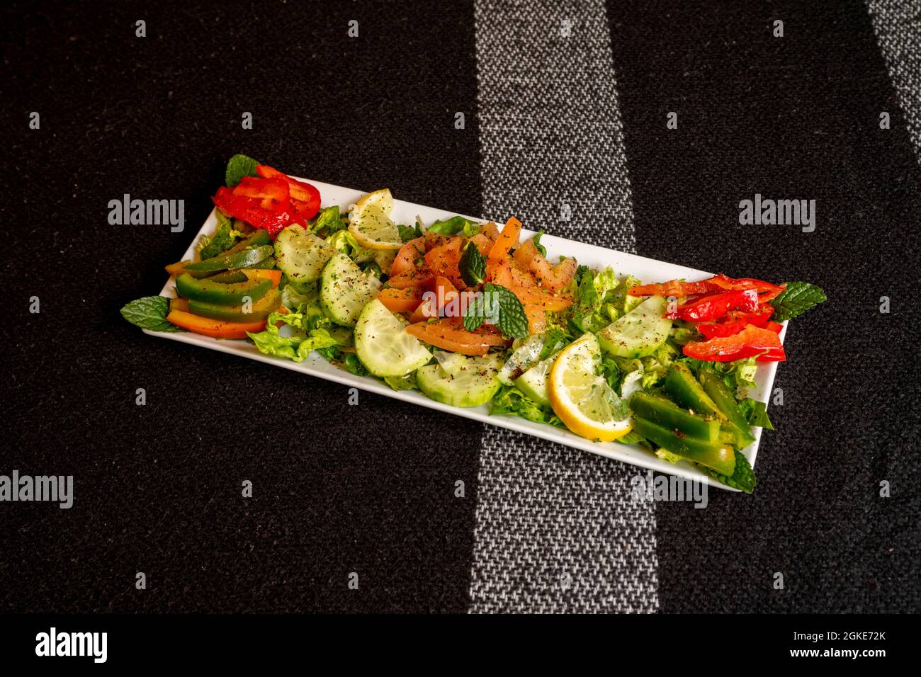 Traditional Lebanese fattoush salad with peppers, lemon, cucumber and ...