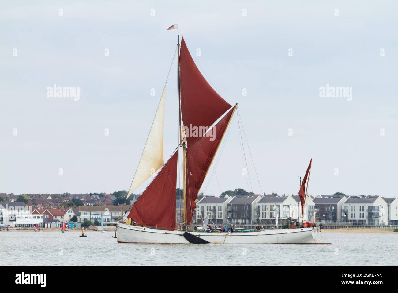 Thames barge 'Reminder' sailing past Brightlingsea on the River Colne in Essex. The barge was ...