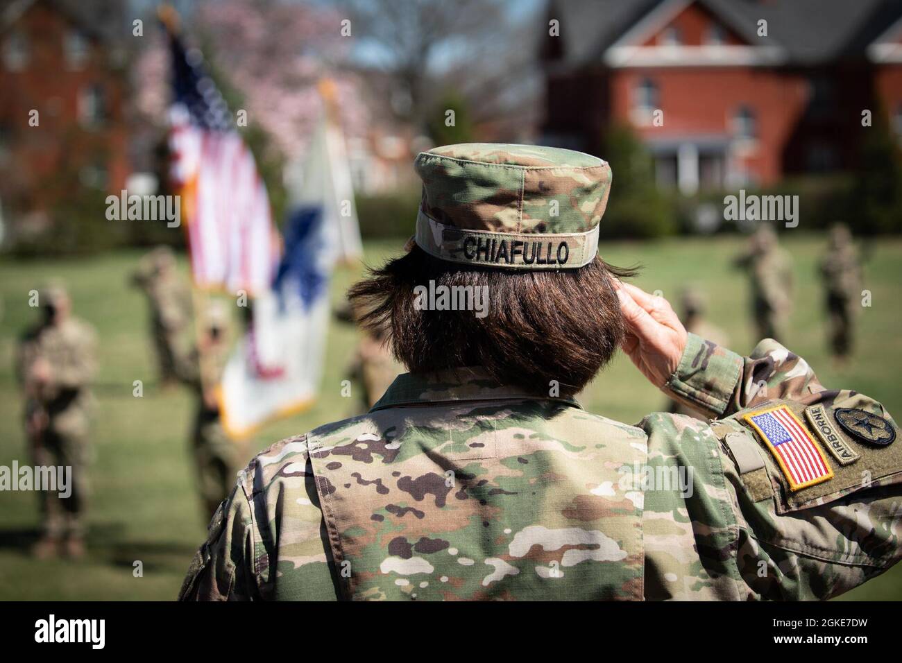 Brig. Gen. (Retired) Marilyn Chiafullo salutes the national colors ...
