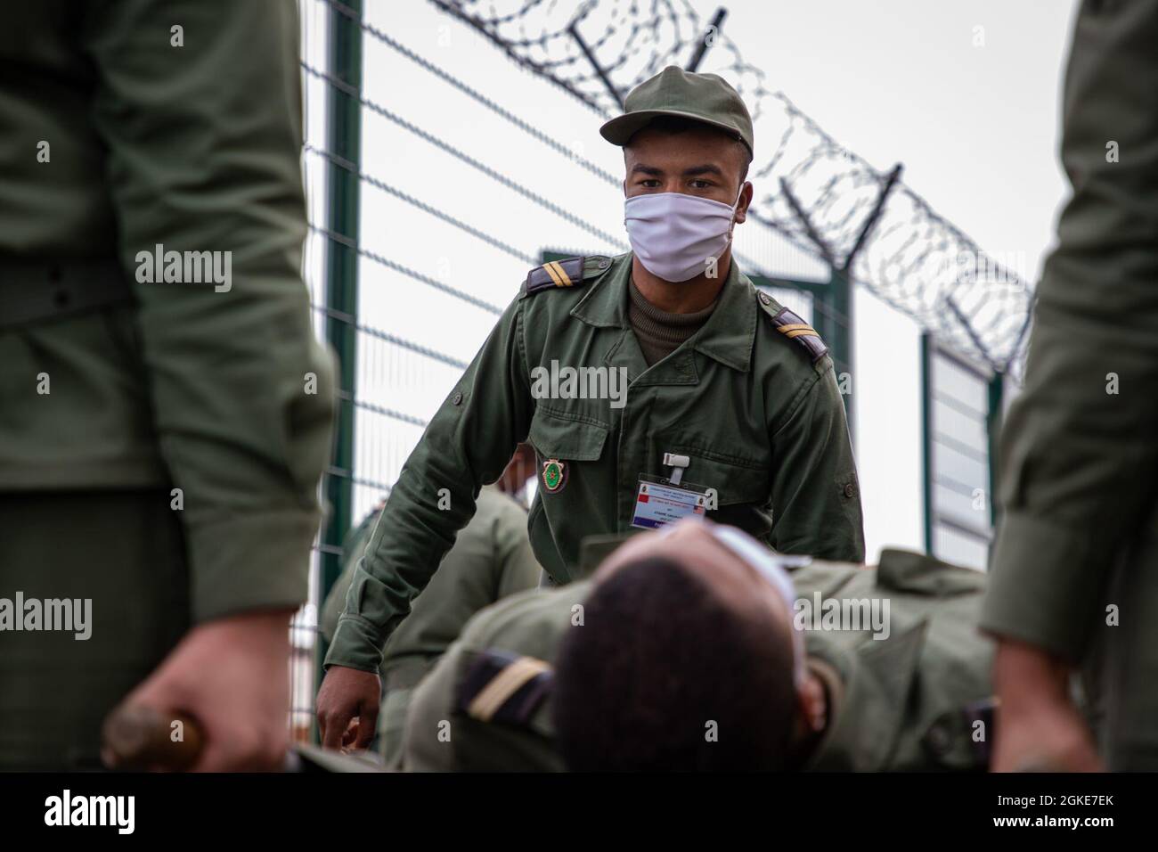 A Member of the Royal Moroccan Armed Forces carry a stretcher during a ...