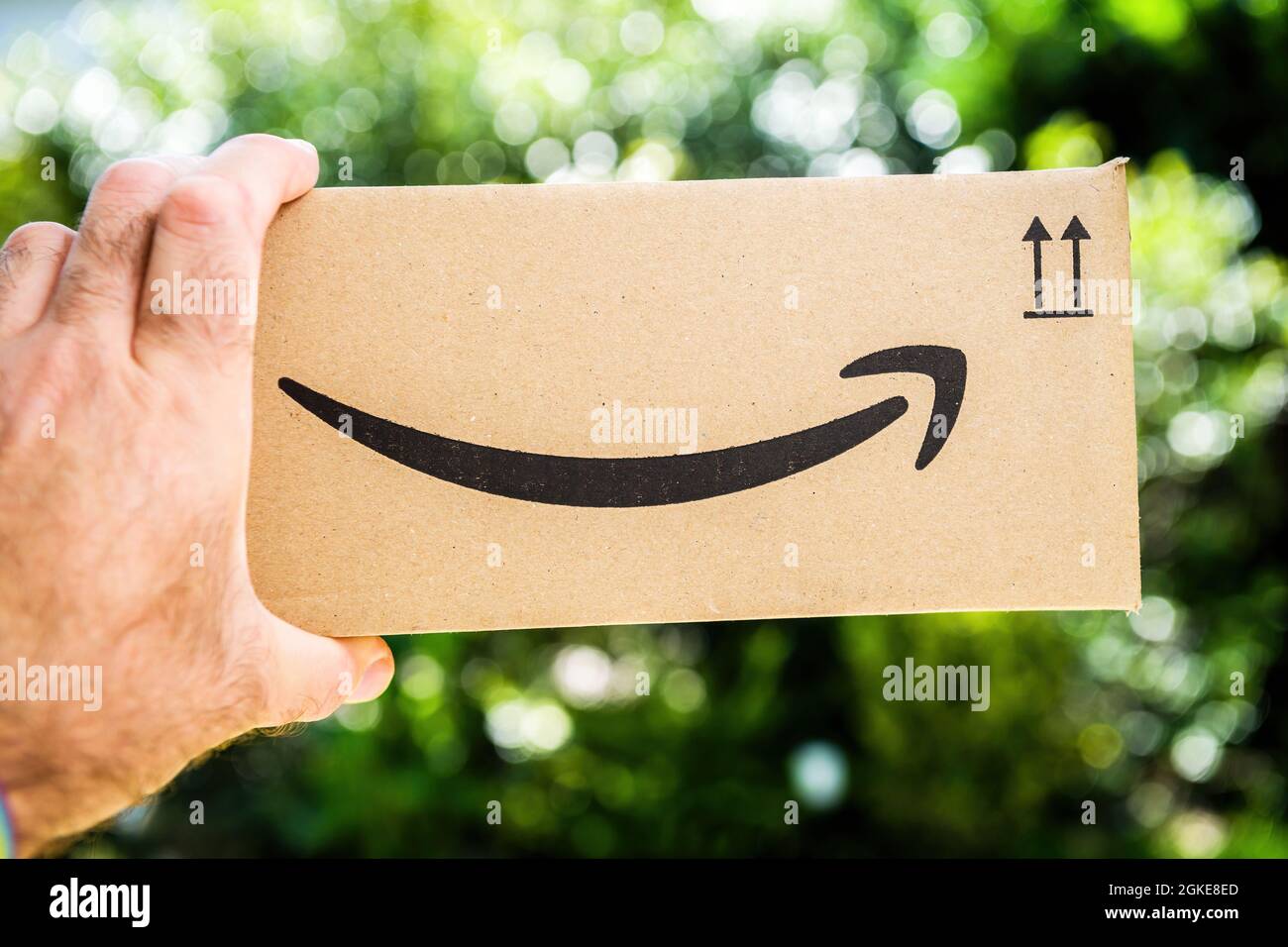 POV personal perspective male hand holding Amazon prime cardboard ...