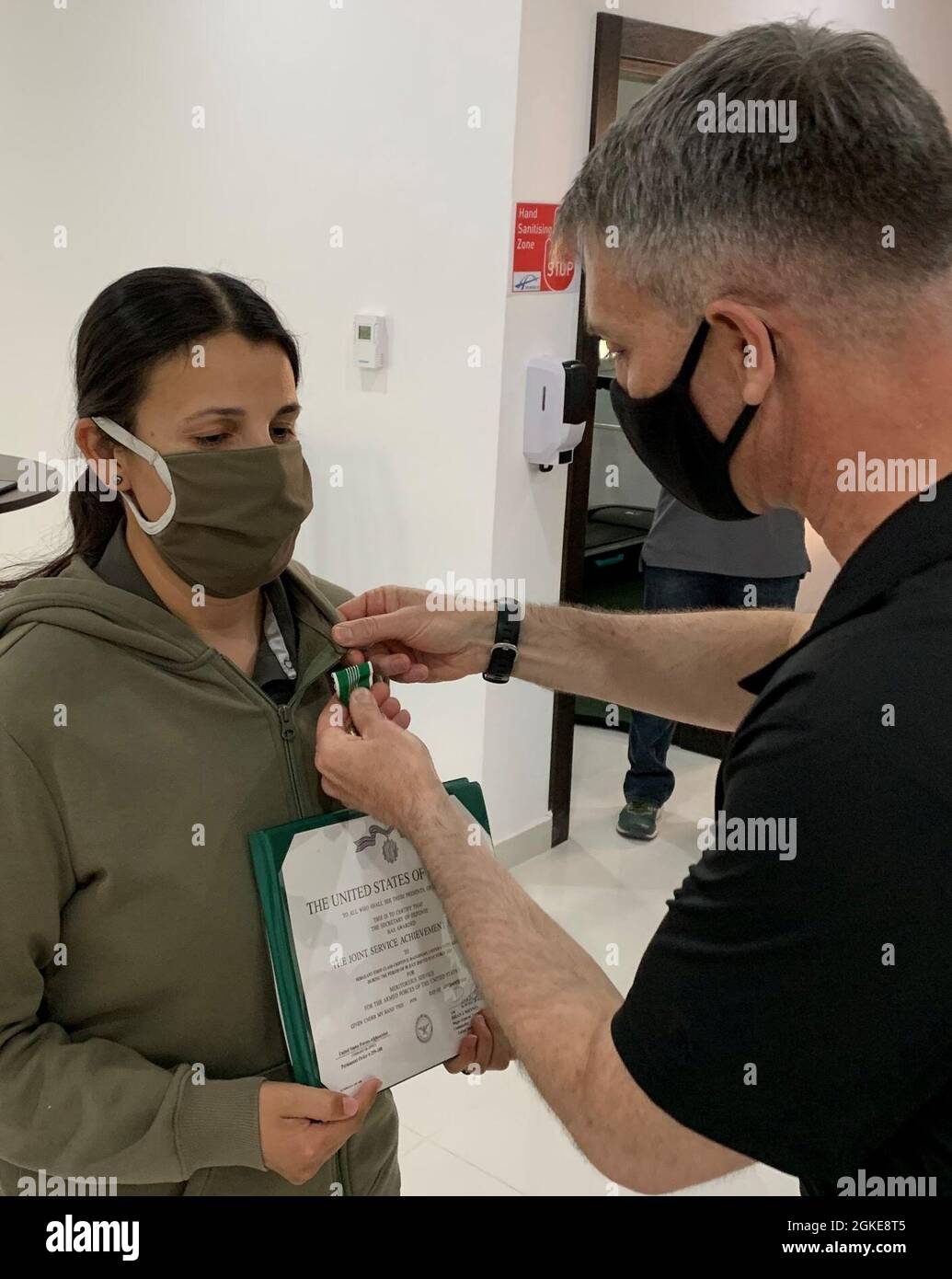 The Army Commendation Medal is pinned on Sergeant First Class Cristin ...